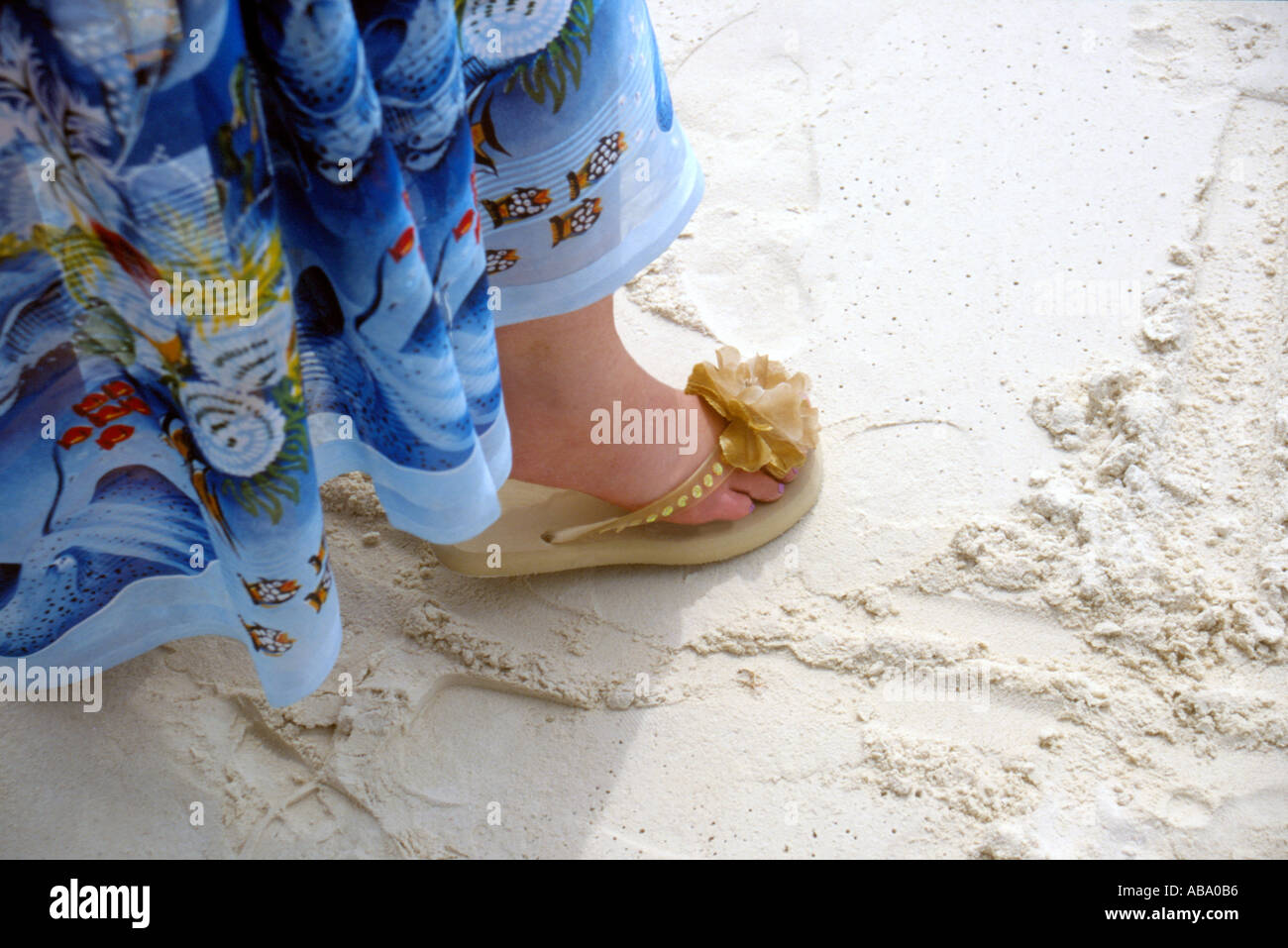 Walking along beach in sarong and flip flops Baros island resort ...