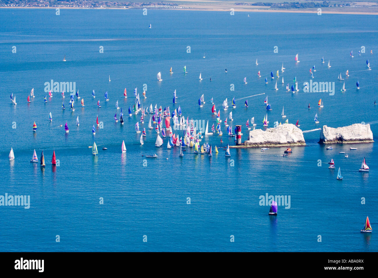 Aerial view. Yachts sailing round the Needles lighthouse, Isle of Wight ...