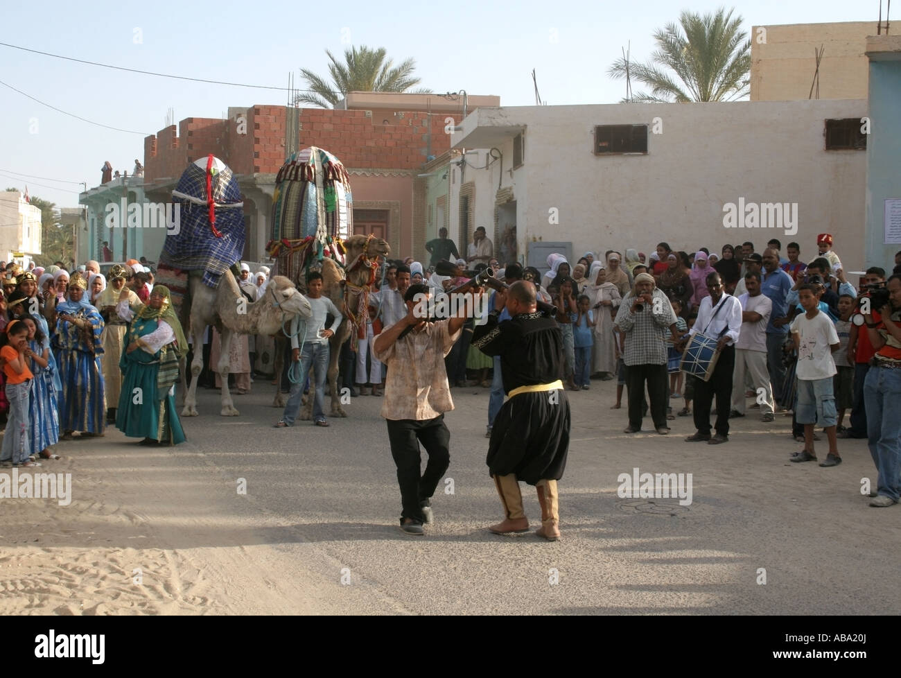 Acrobats dancing with guns during a wedding procession in Tozeur south ...