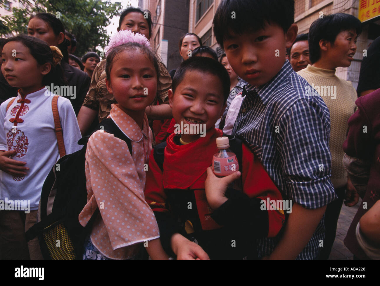 Children on the street of Fuling China pose for the camera on a hot ...