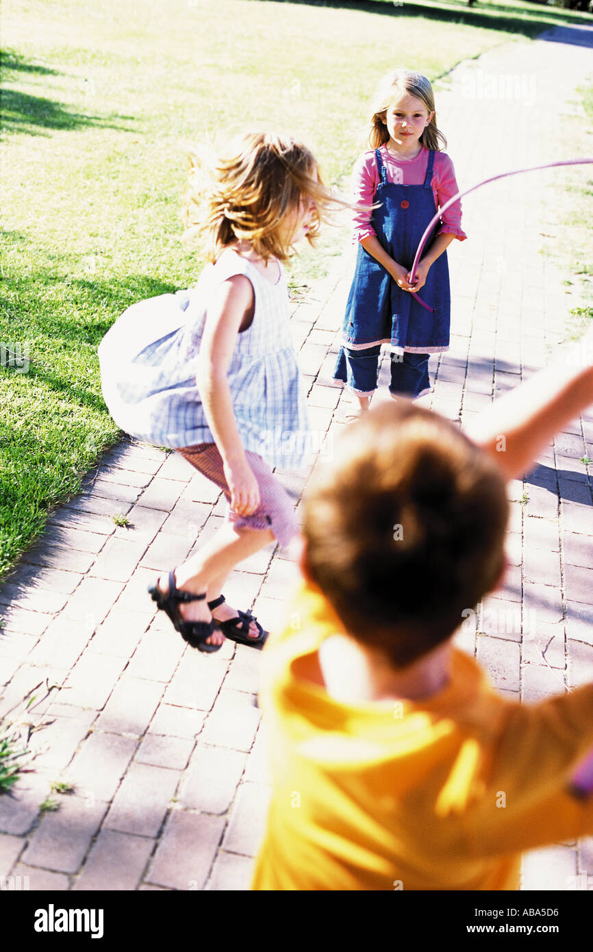 Kids playing in a playground Stock Photo - Alamy