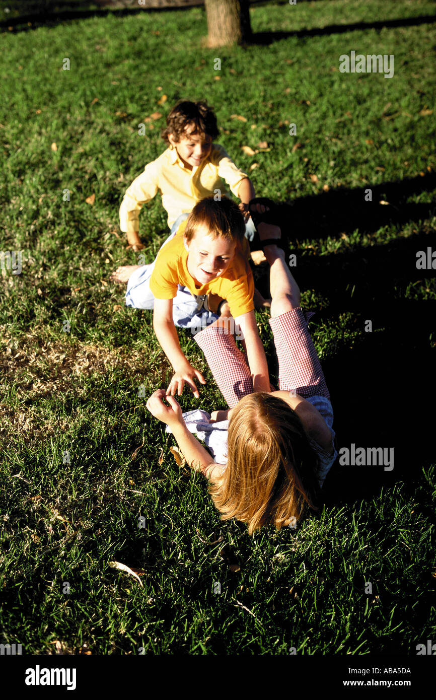 Kid playing on the grass Stock Photo - Alamy