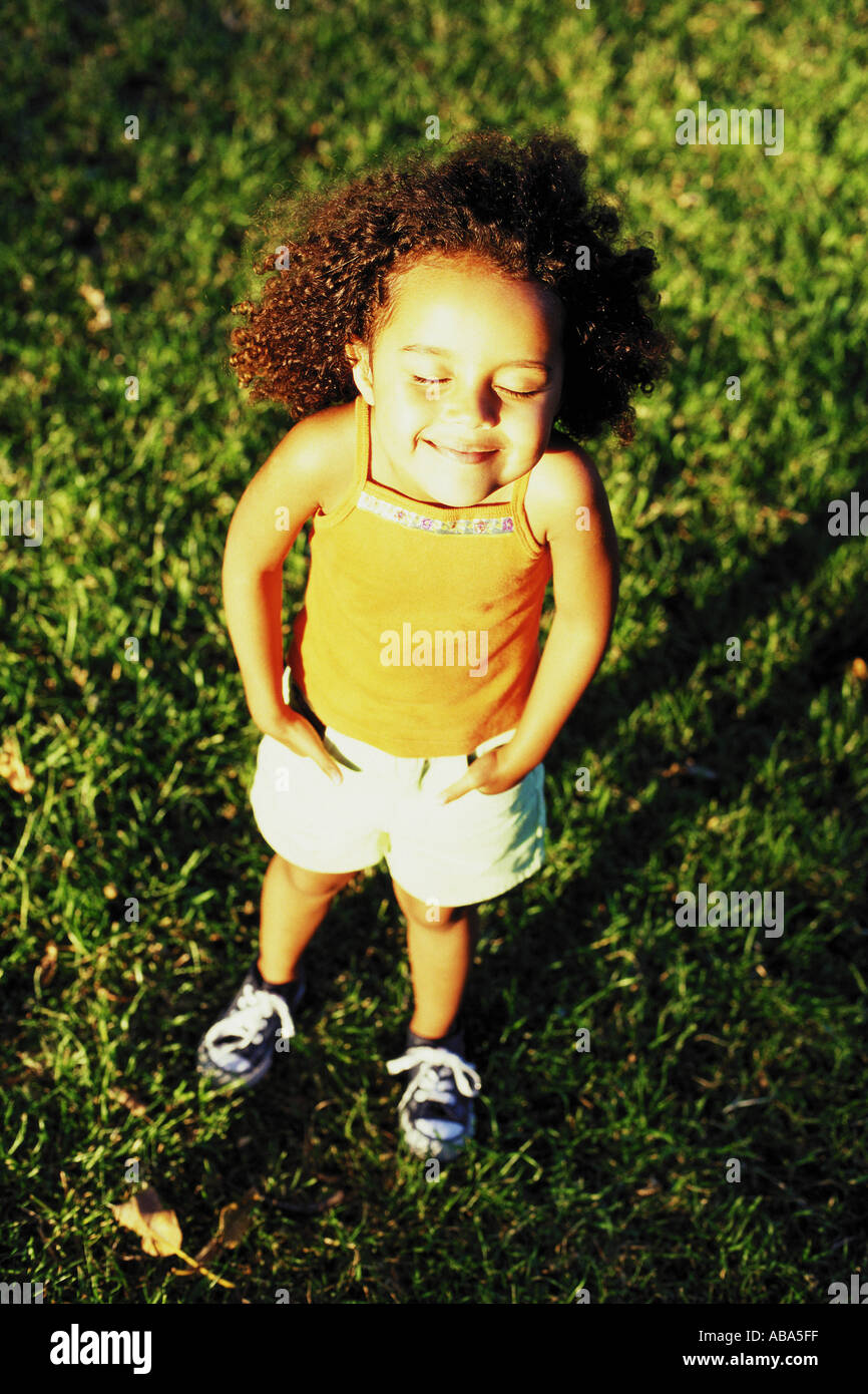 Girl enjoying the sun Stock Photo - Alamy