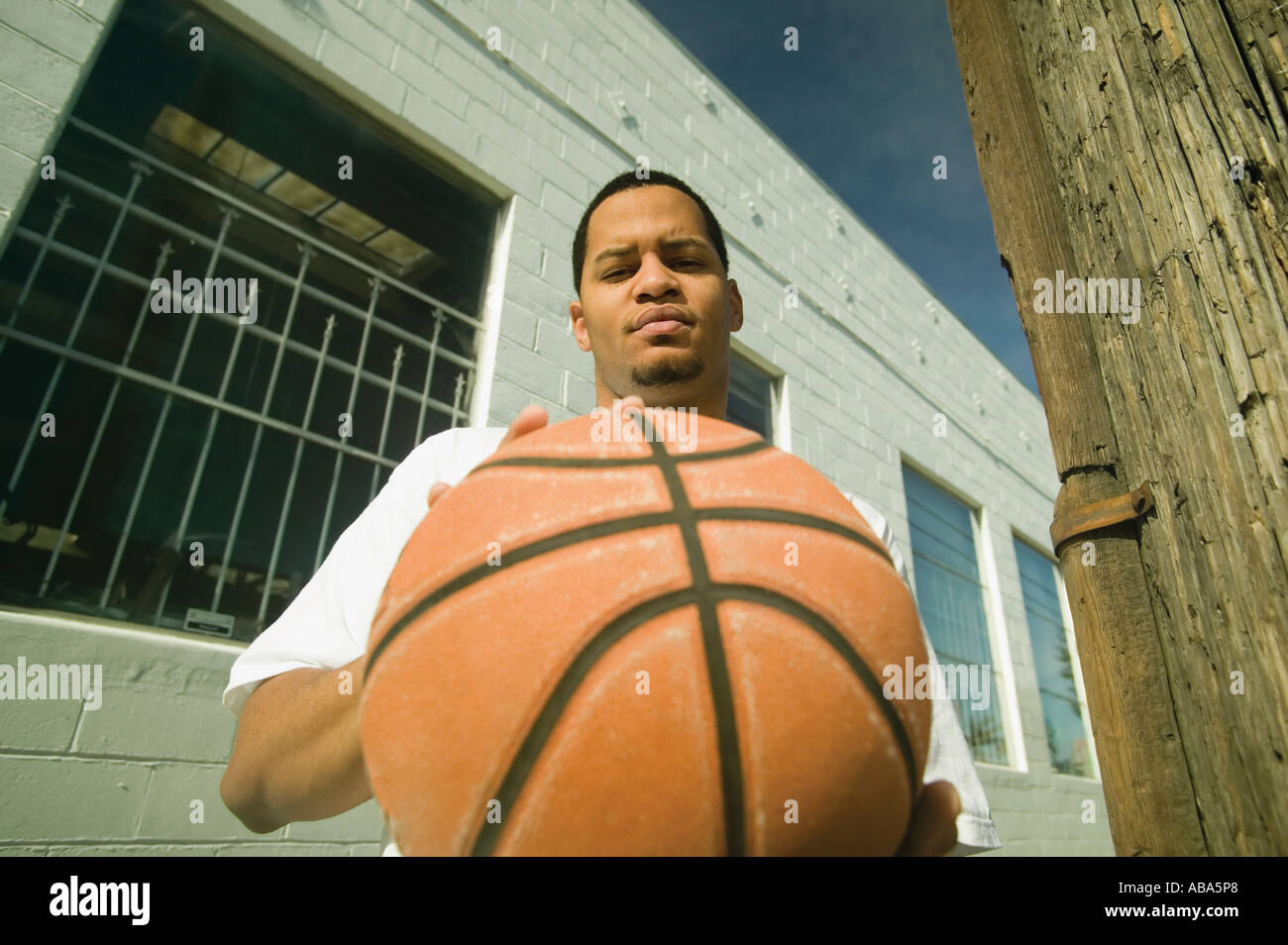 Man bouncing a basketball hi-res stock photography and images - Alamy