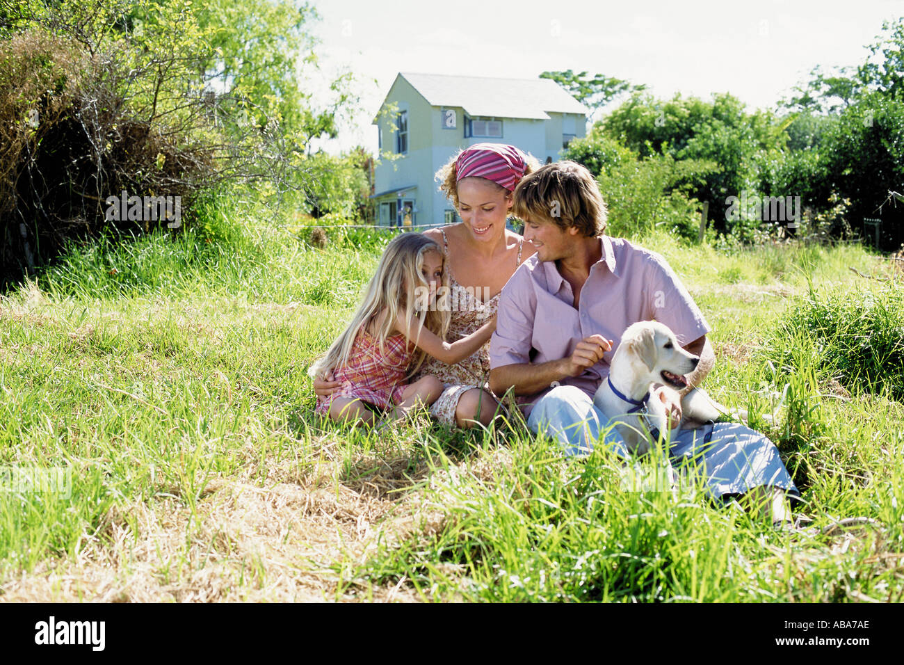 Family chilling out in the sun Stock Photo - Alamy