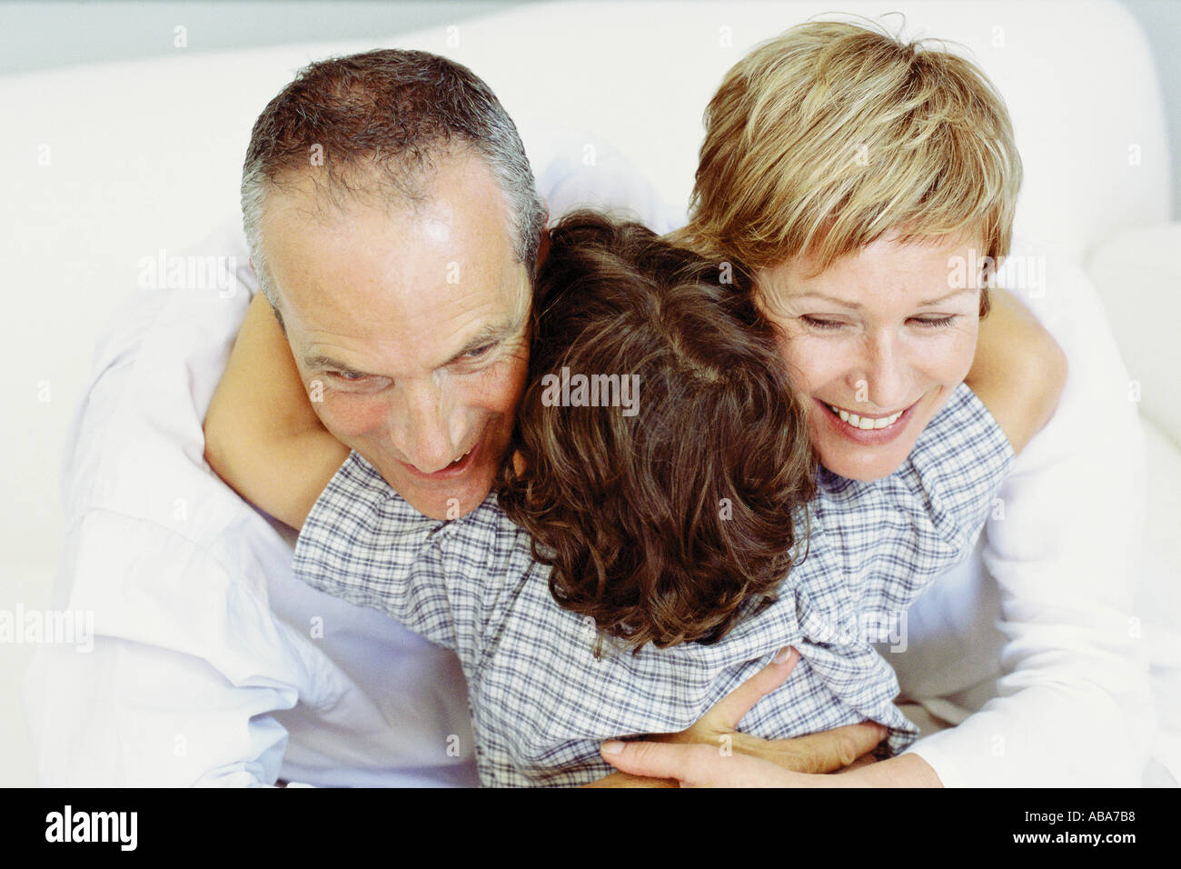 Boy hugging grandparents Stock Photo - Alamy
