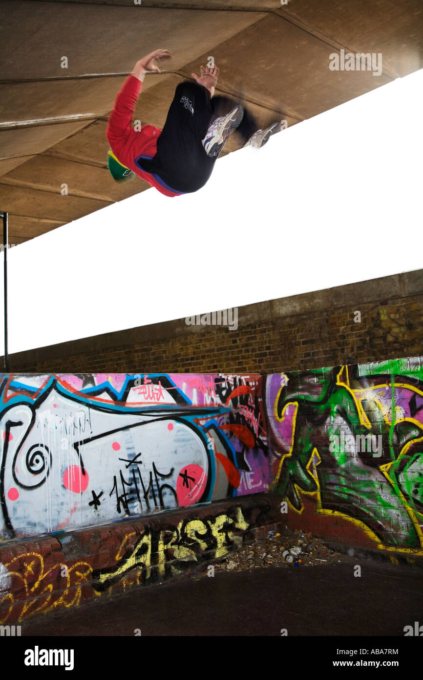 Young man doing back flip Stock Photo - Alamy