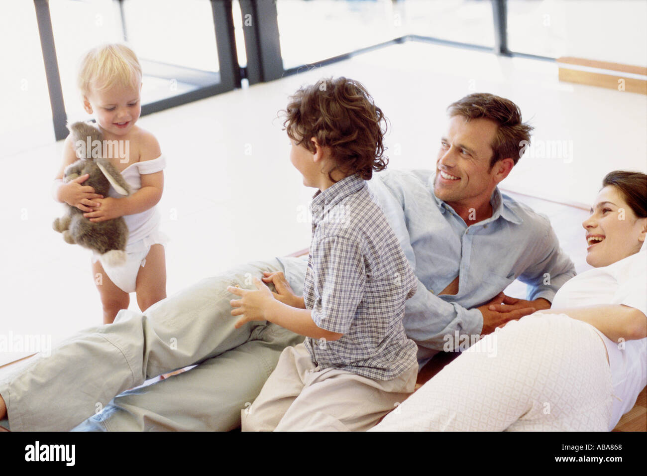 Happy family at home Stock Photo - Alamy