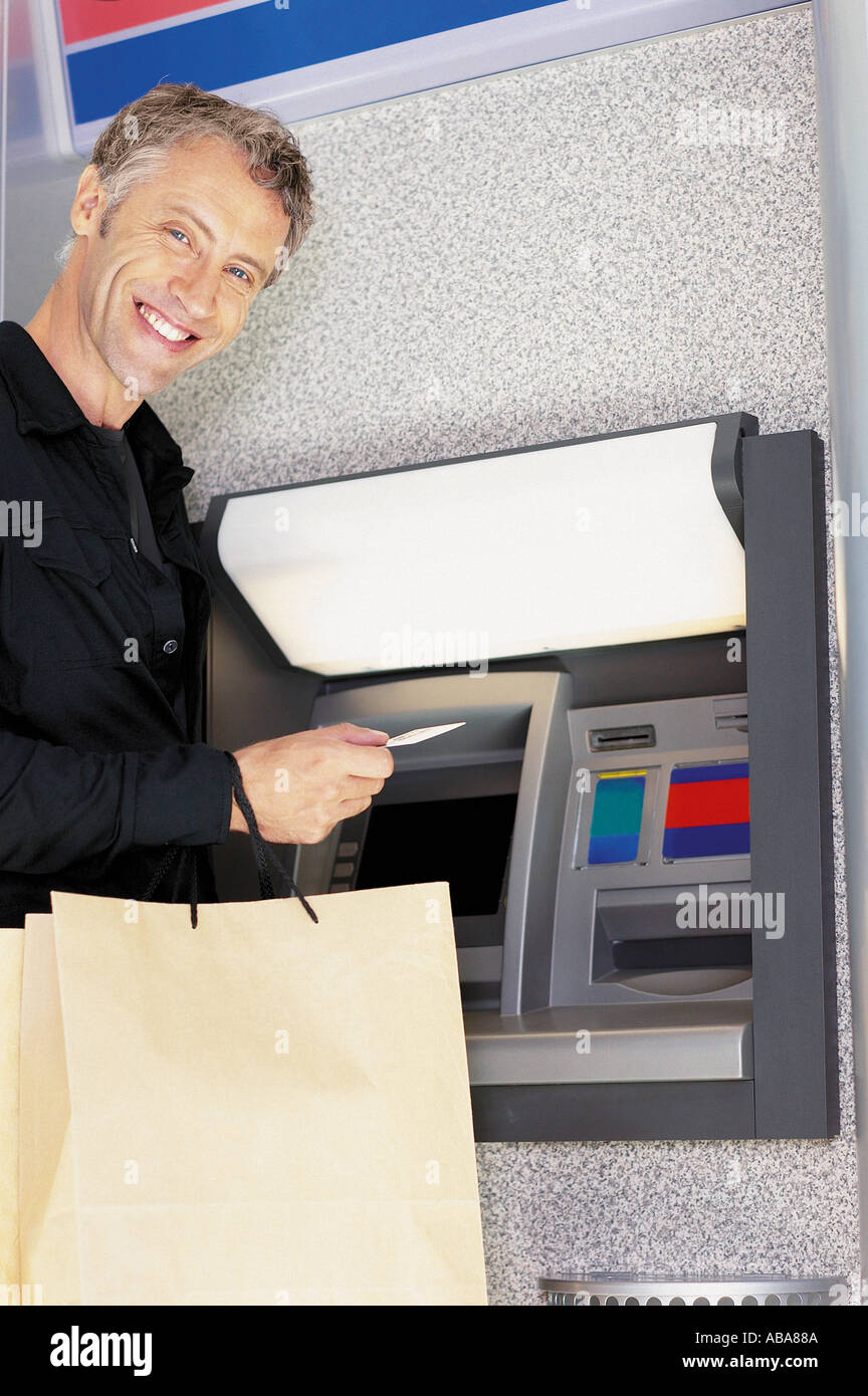 Man at cash machine Stock Photo - Alamy