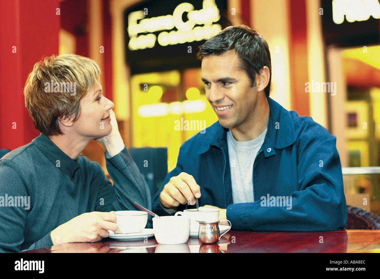 Couple having a coffee Stock Photo - Alamy