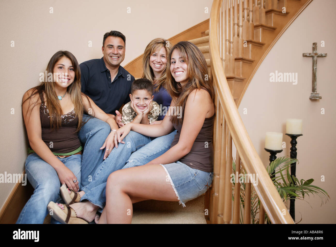 Family smiling for the camera together Stock Photo - Alamy