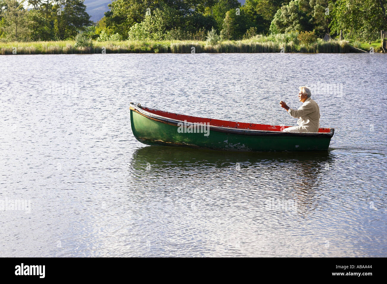 Man in boat Stock Photo - Alamy