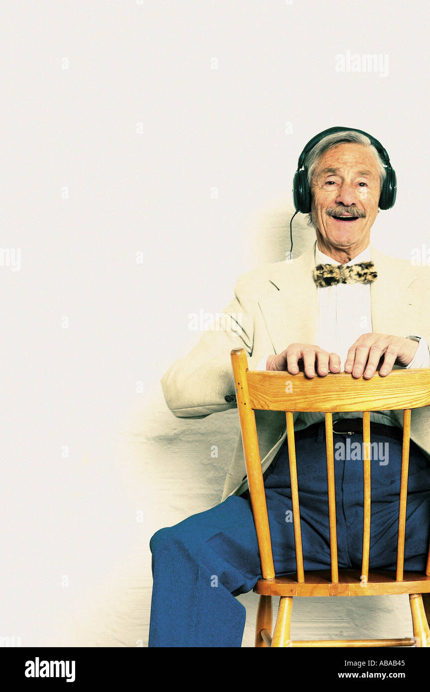 Old man listening to music Stock Photo - Alamy
