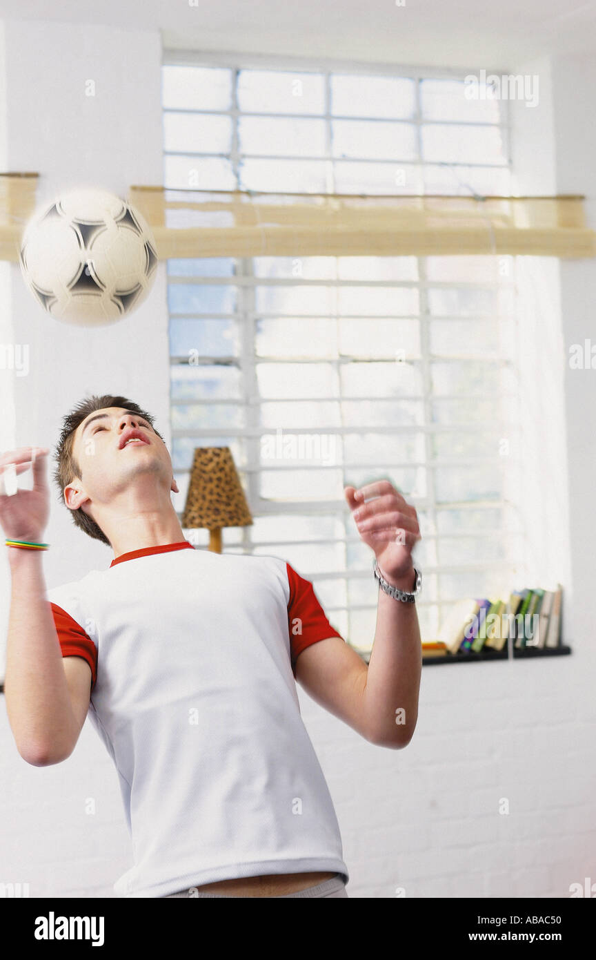 Football child heading hi-res stock photography and images - Alamy