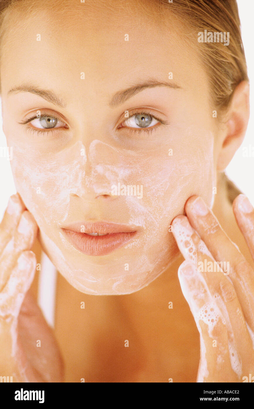 Woman washing face Stock Photo - Alamy