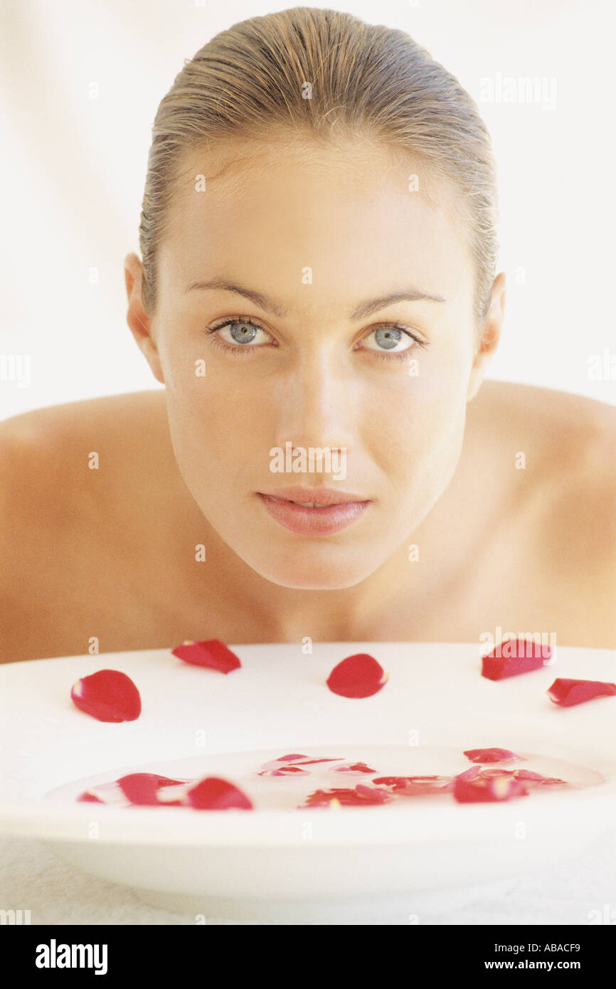 Woman rinsing face Stock Photo - Alamy