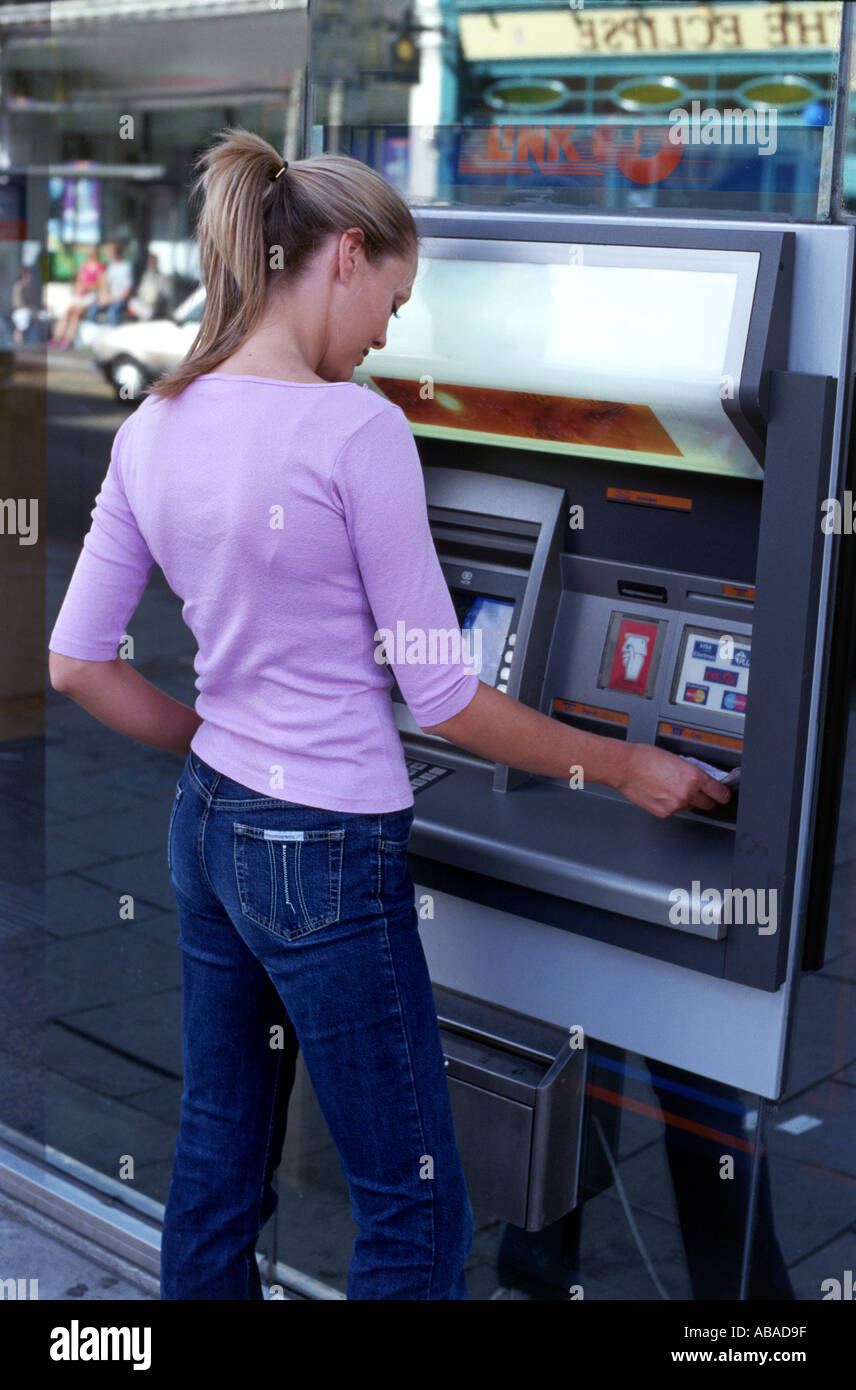 Girl cashing money Stock Photo - Alamy