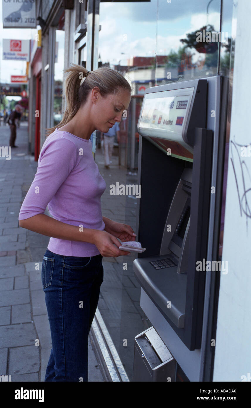 Girl cashing money Stock Photo - Alamy