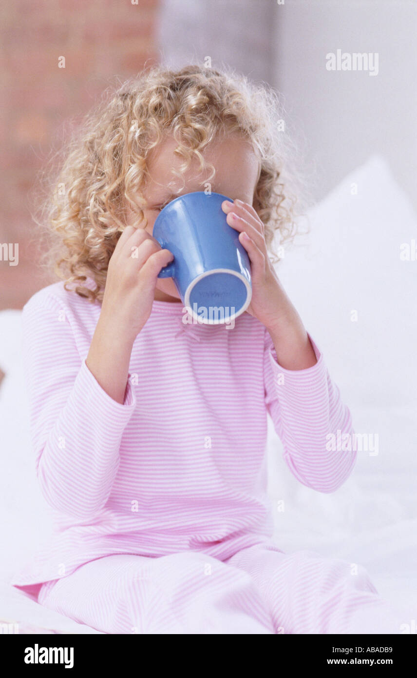 Girl drinking tea Stock Photo - Alamy