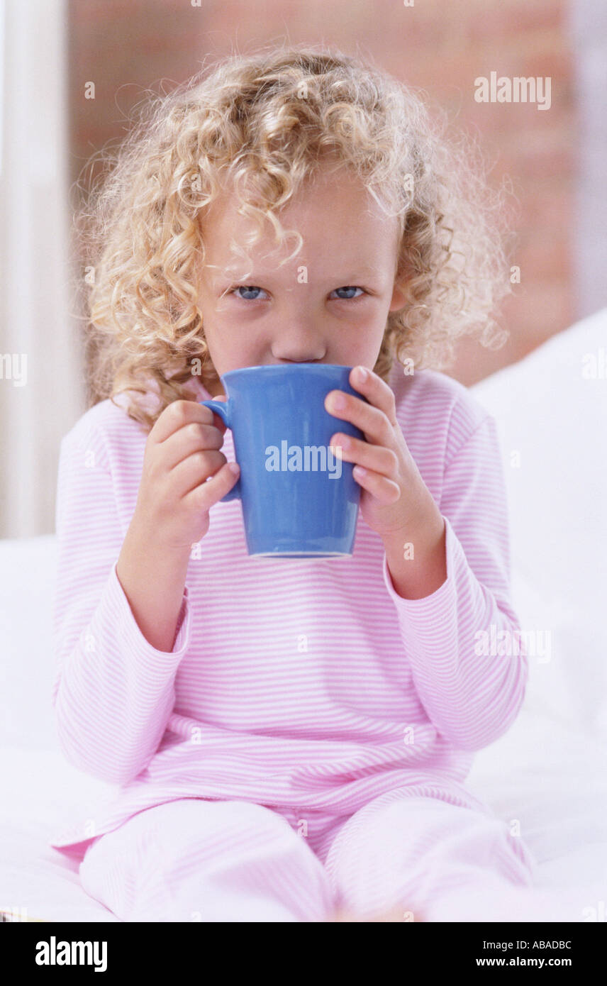 Girl drinking tea Stock Photo - Alamy