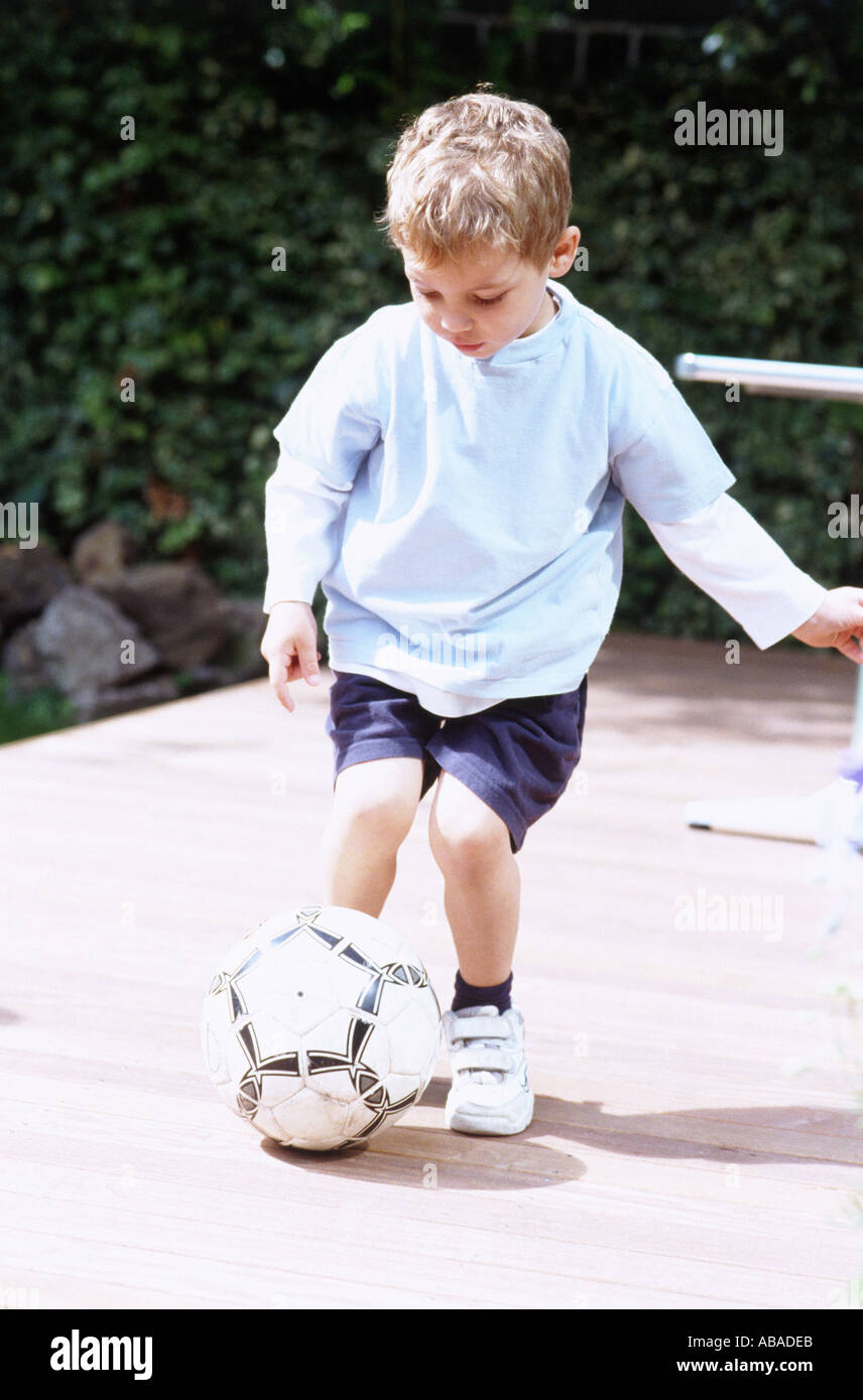 Boy playing ball Stock Photo - Alamy