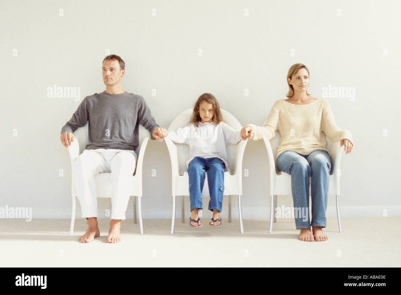 Serious looking family Stock Photo - Alamy