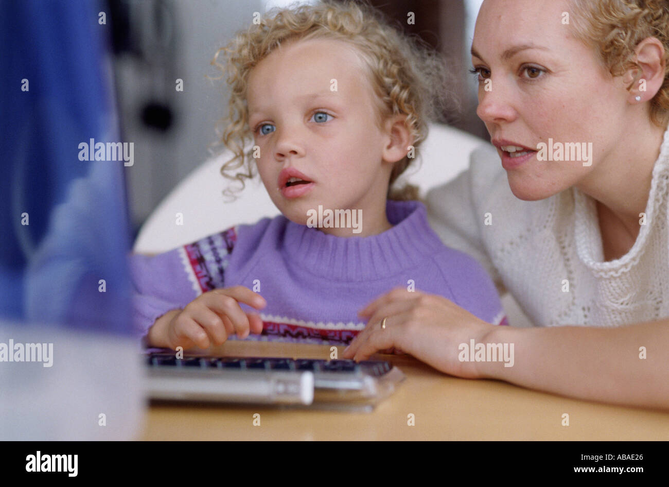 Mother and daughter at computer Stock Photo - Alamy