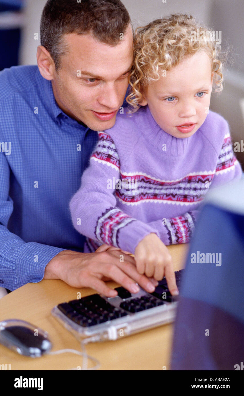 Father and daughter at computer Stock Photo - Alamy