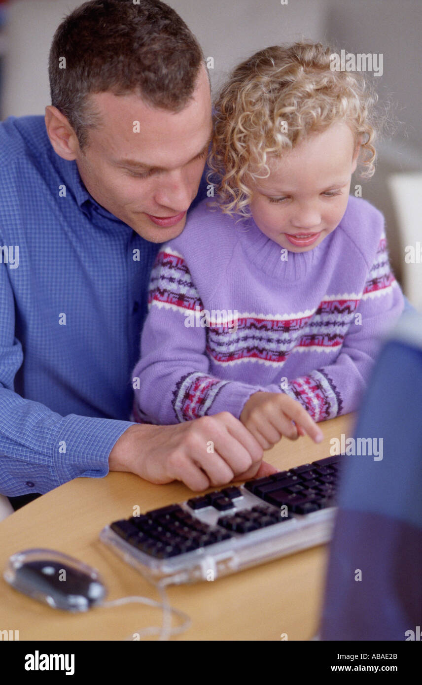 Father and daughter at computer Stock Photo - Alamy