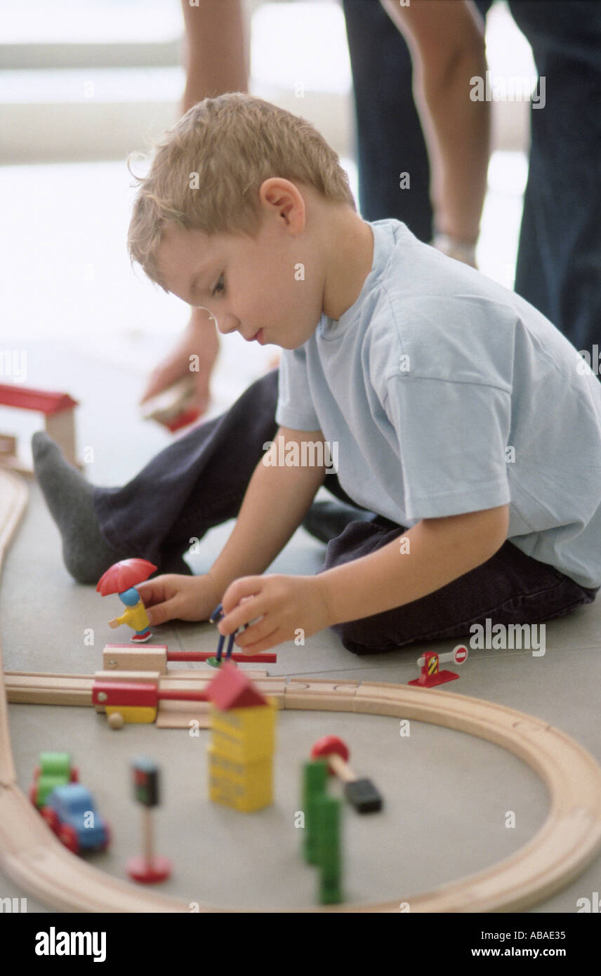 Boy playing with model railway Stock Photo - Alamy