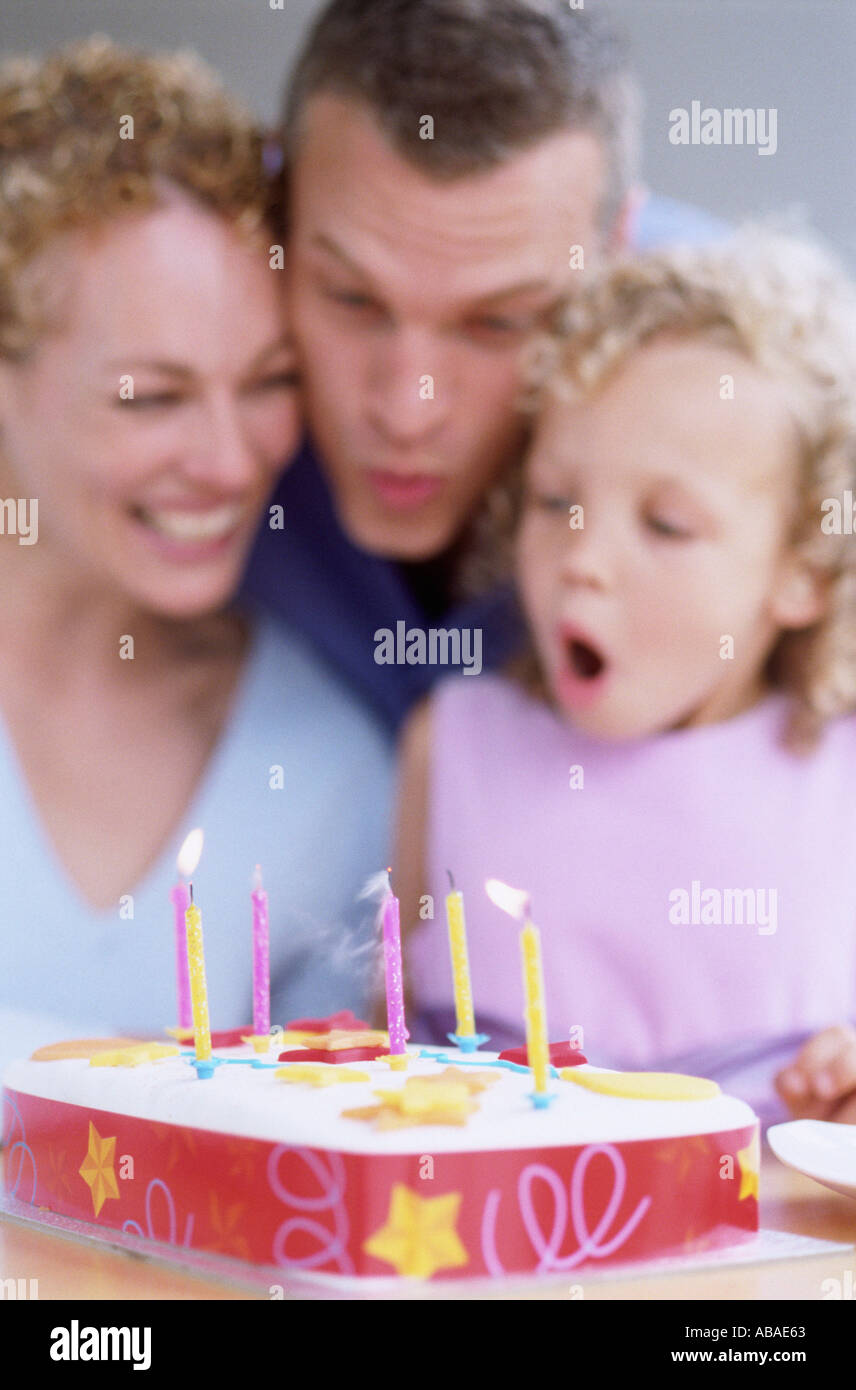 Family with birthday cake Stock Photo - Alamy