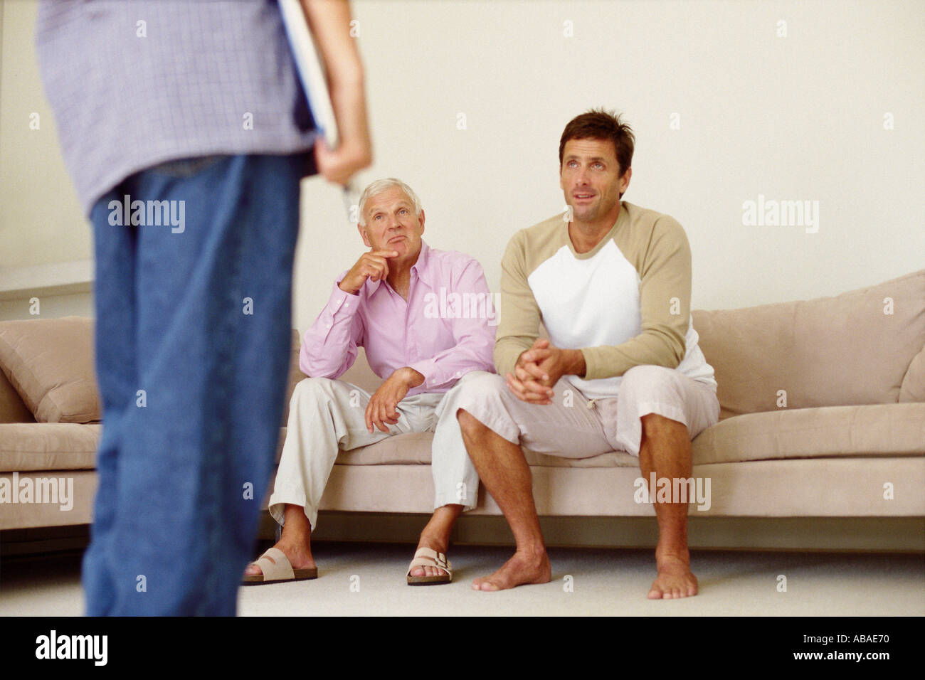 Father talking to son in living room Stock Photo - Alamy