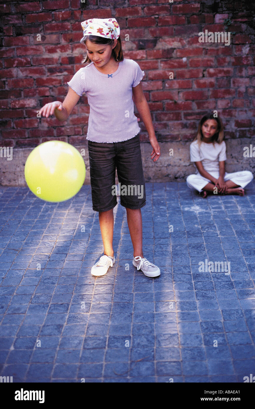 Girls playing with a ball Stock Photo - Alamy