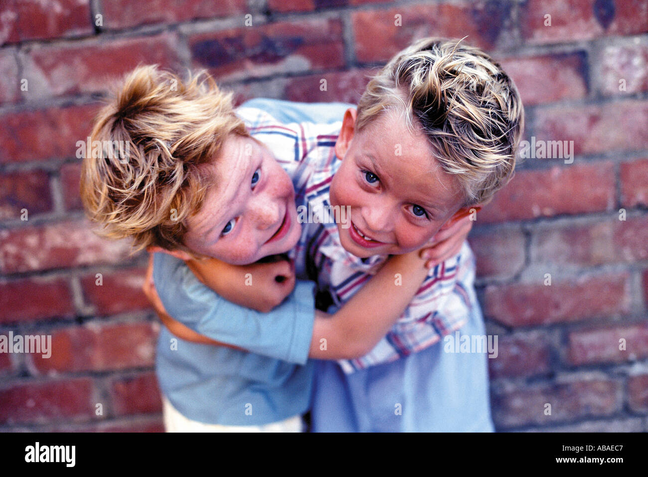Boys fighting against wall Stock Photo - Alamy