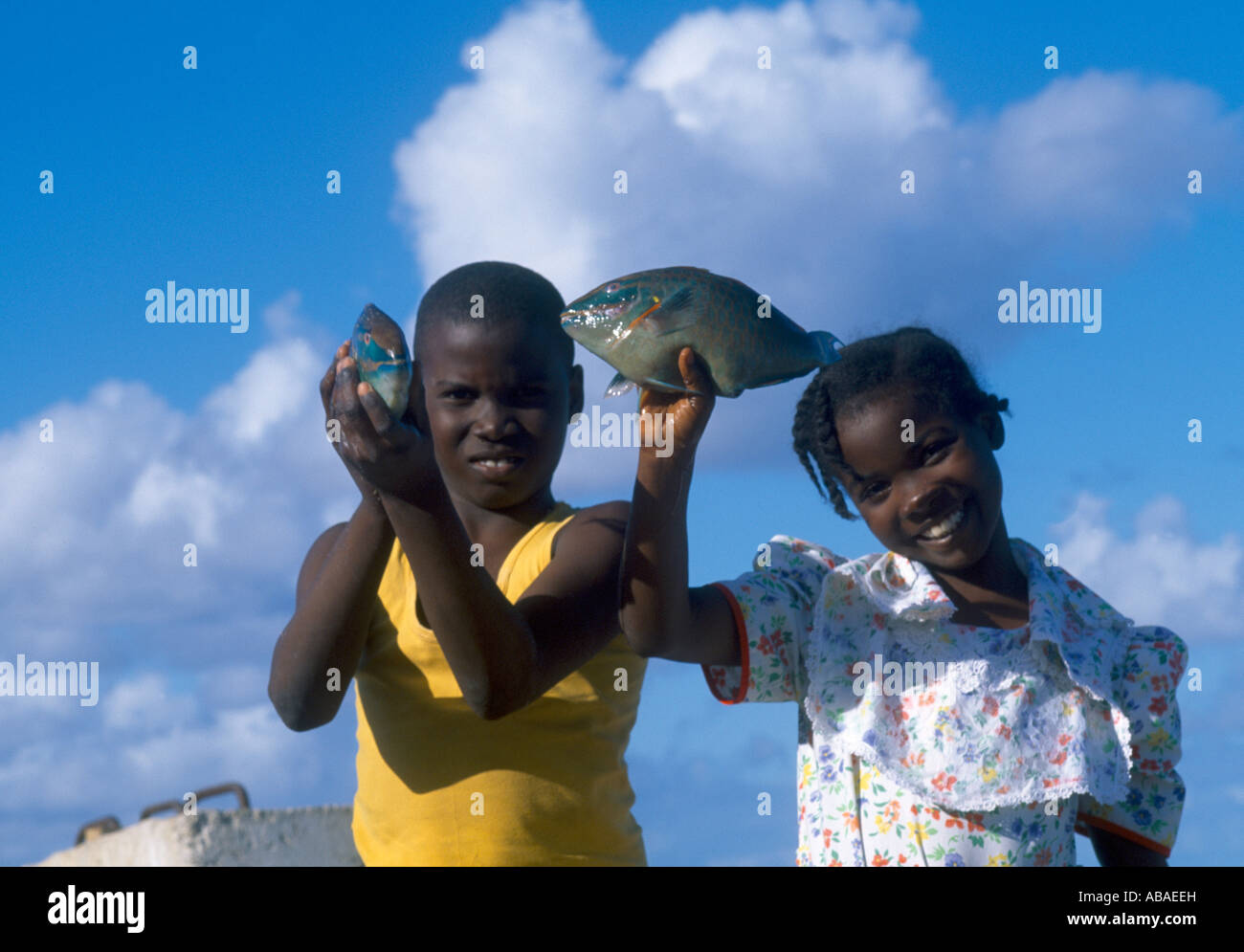 Nevis St Kitts Herberts Beach Children Holding Fish Stock Photo - Alamy