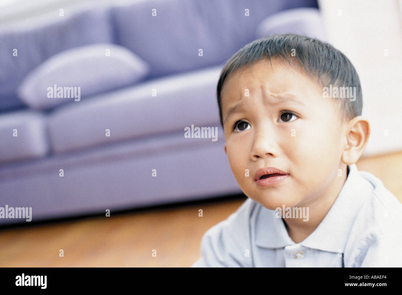 Boy looking confused Stock Photo - Alamy