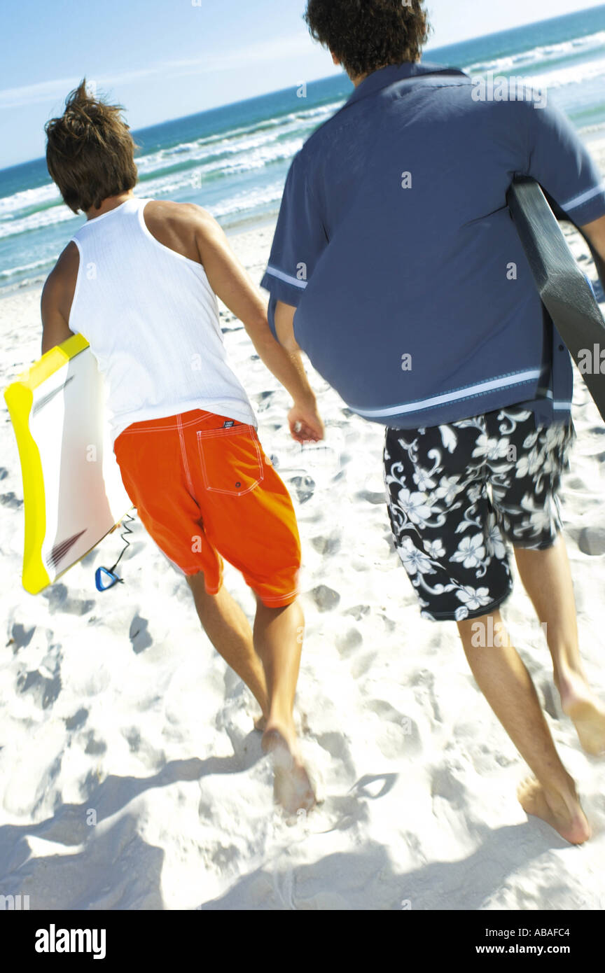 Men with boogie boards Stock Photo - Alamy