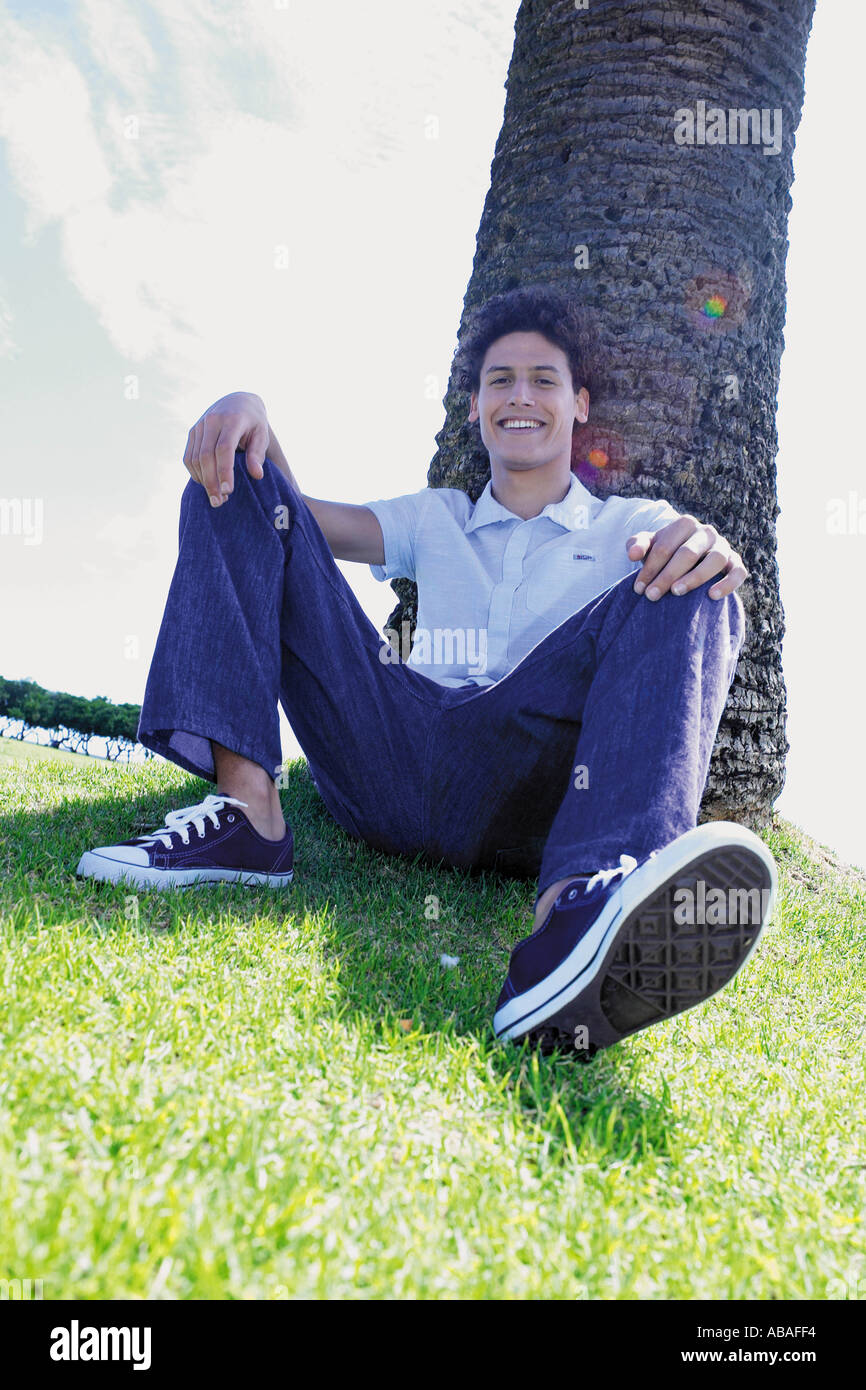 Man leaning against tree hi-res stock photography and images - Alamy