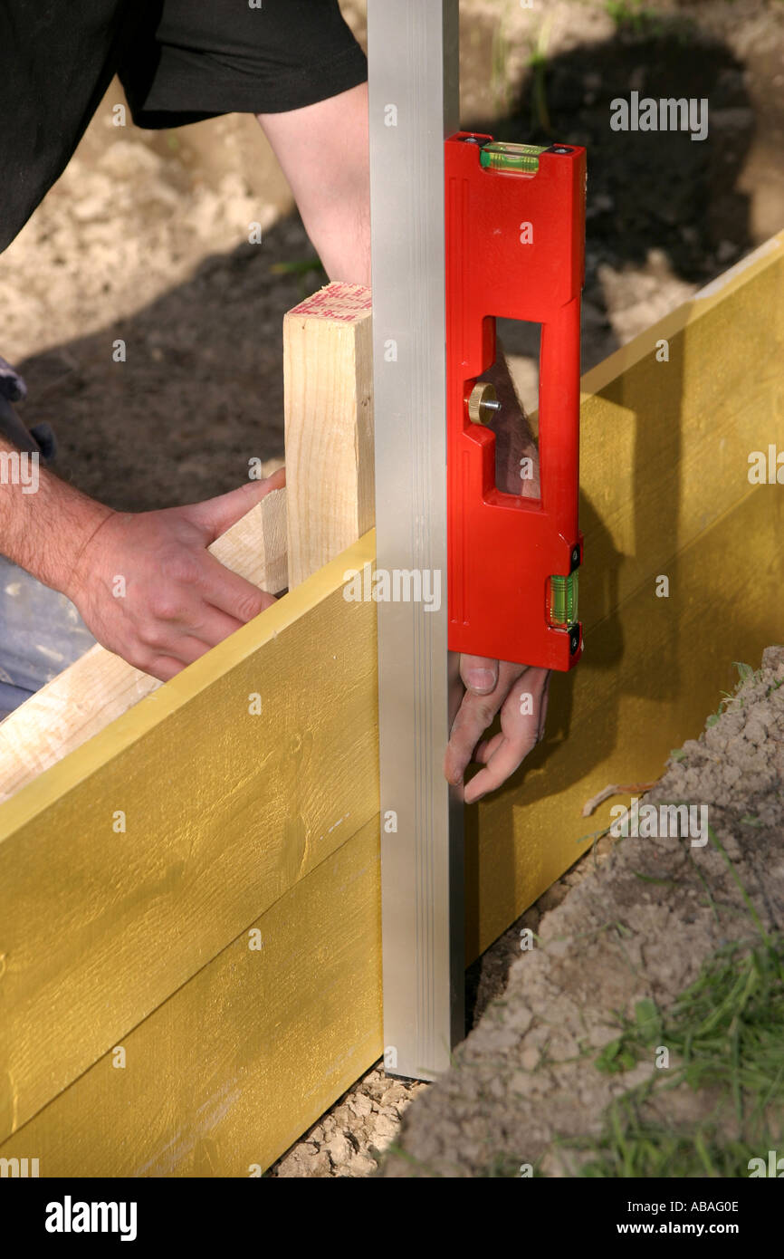 Using a water level tool Stock Photo - Alamy