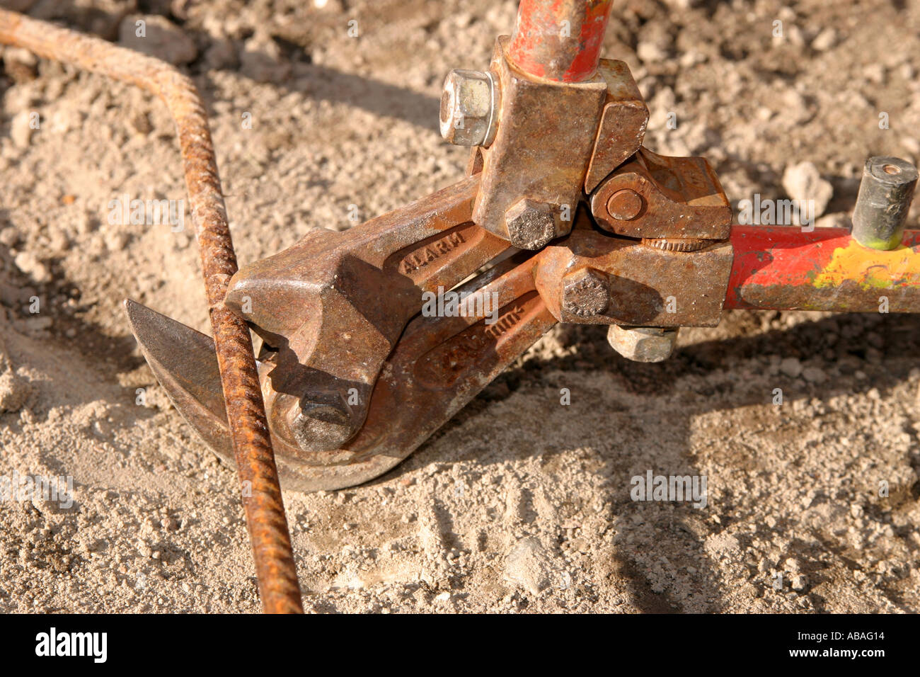 Using a cutting pliers on an iron reinforcement bar Stock Photo - Alamy