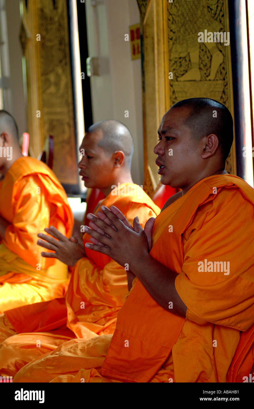 Buddhist monks holding prayers Stock Photo - Alamy
