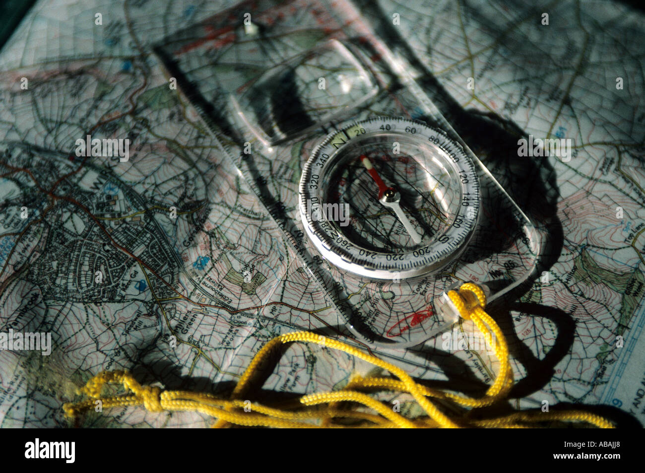 Compass and map Stock Photo - Alamy