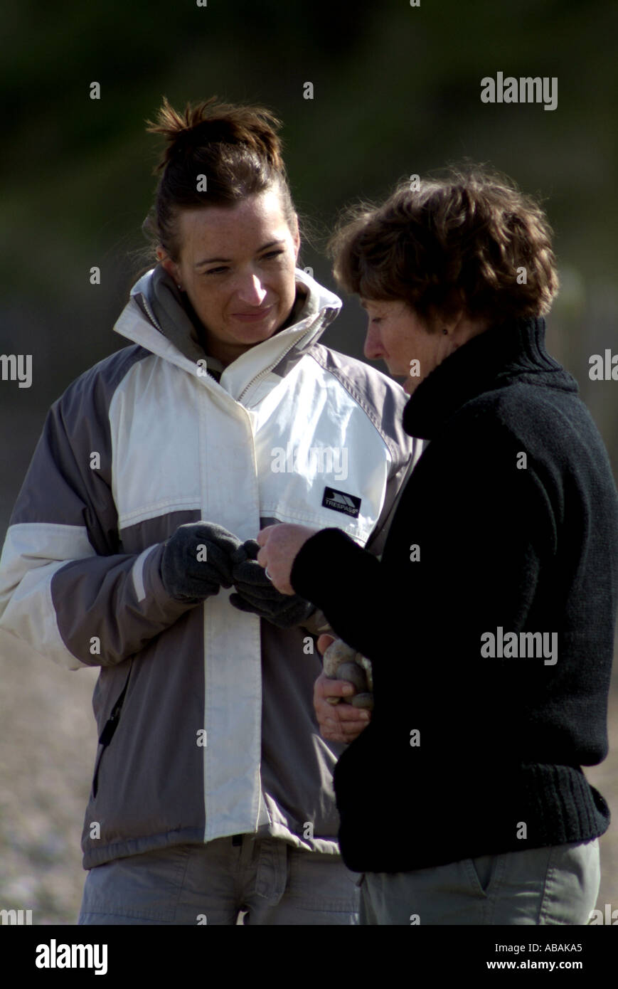 two women interacting Stock Photo - Alamy