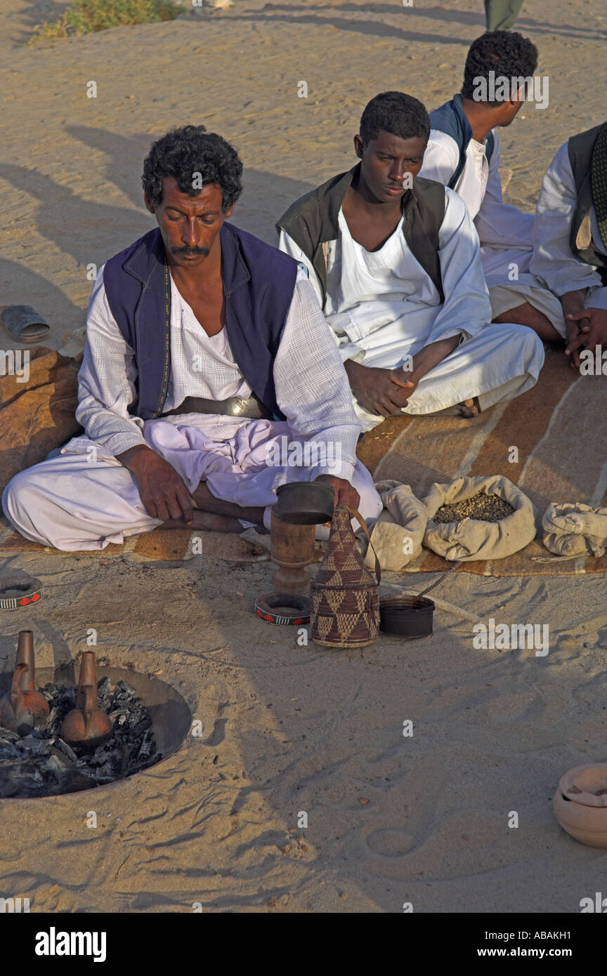 Ababda tribesman sharing early evening coffee in the desert valley of ...