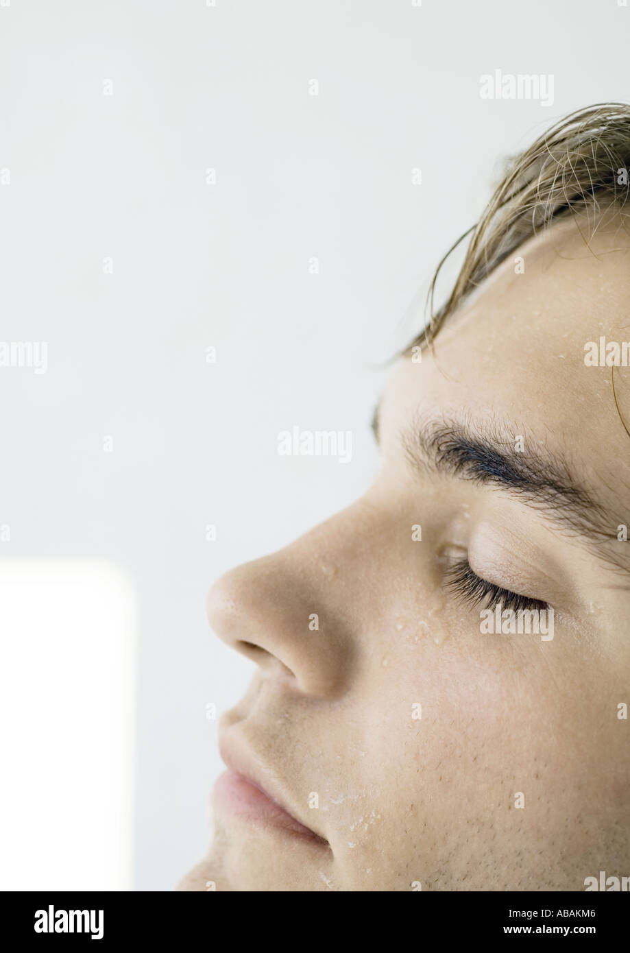Man's face with eyes closed, side view Stock Photo - Alamy