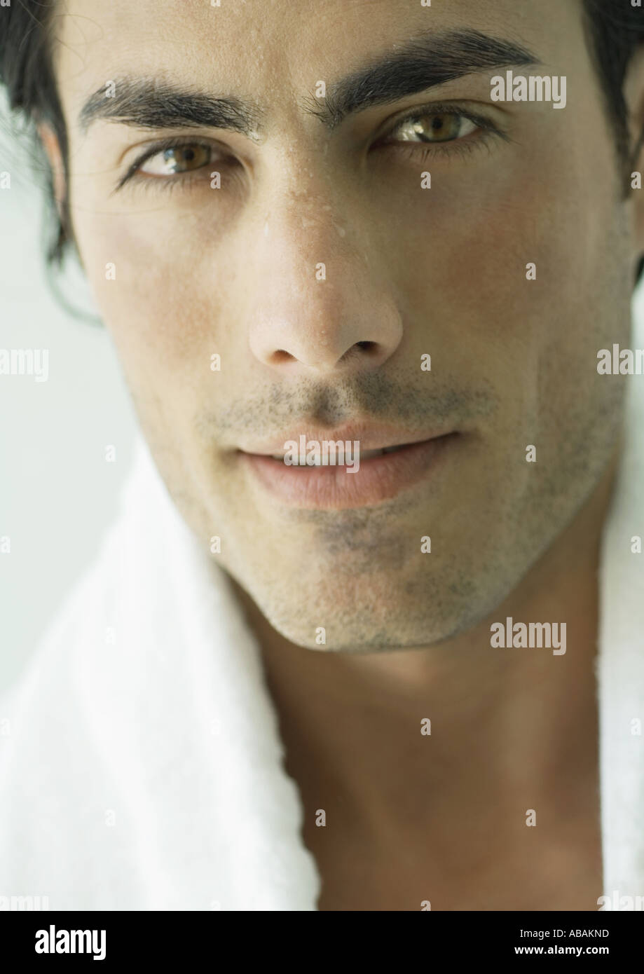 Man with towel around neck, close-up Stock Photo - Alamy