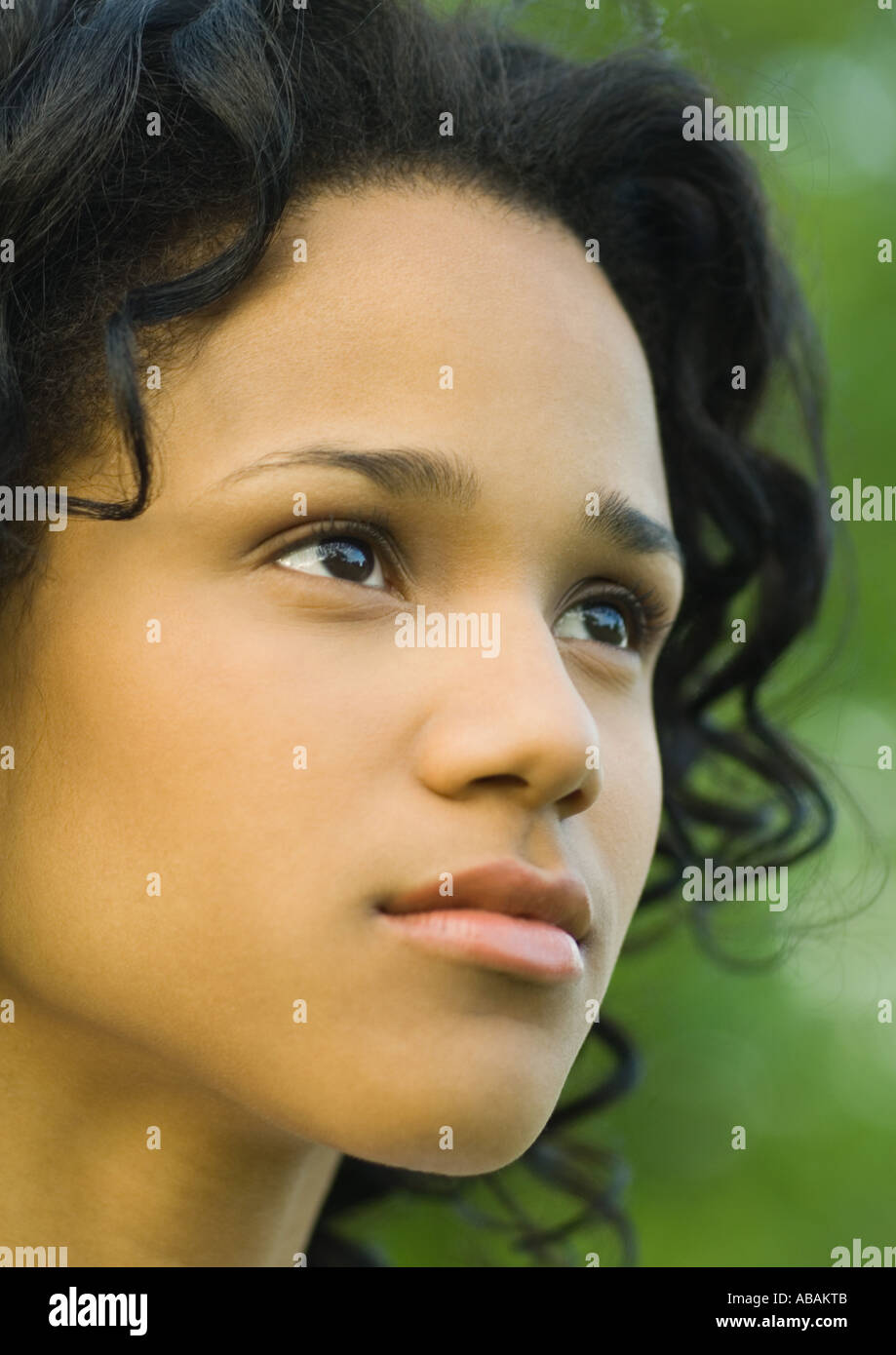 Woman's face, looking into distance Stock Photo - Alamy