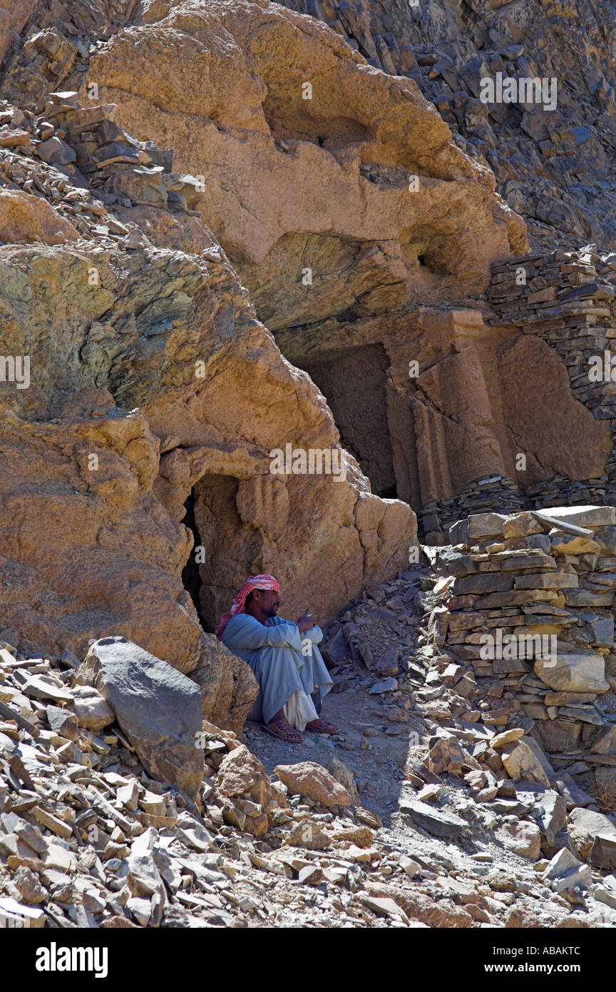Ababda tribesman sitting by temple entrance at Cleopatra emerald mines ...