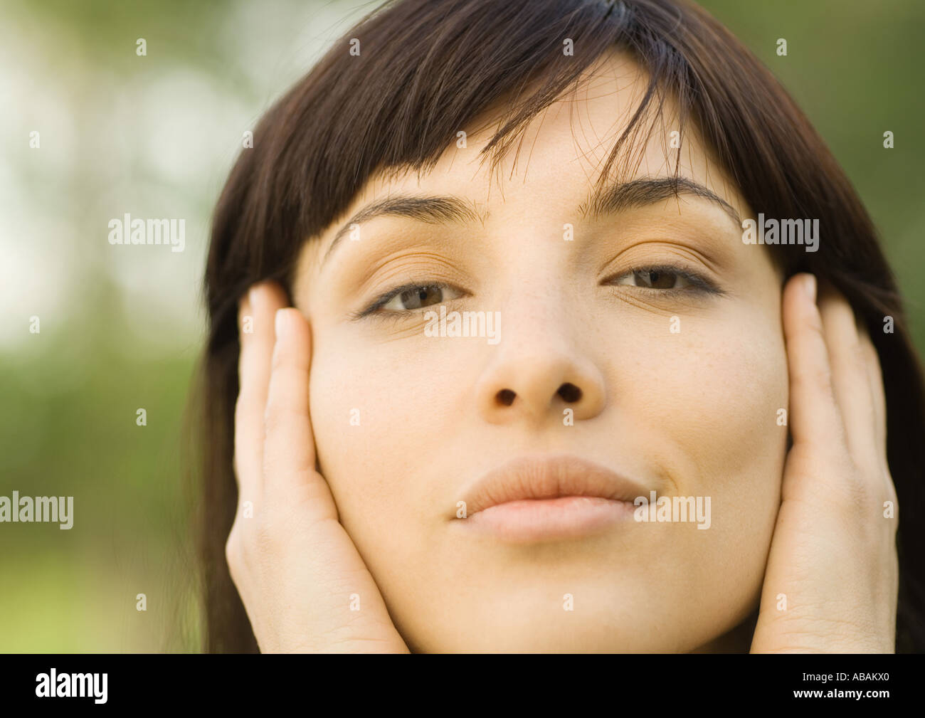 Woman holds cheeks hands hi-res stock photography and images - Alamy