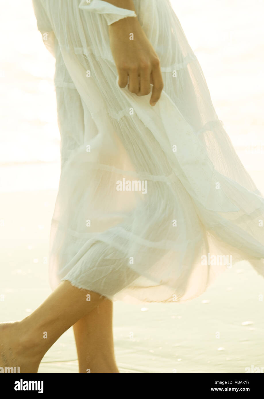 Woman wearing translucent skirt, low section Stock Photo - Alamy